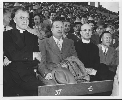 "James J. Deasy and James Maguire in crowd at Salad Bowl game"